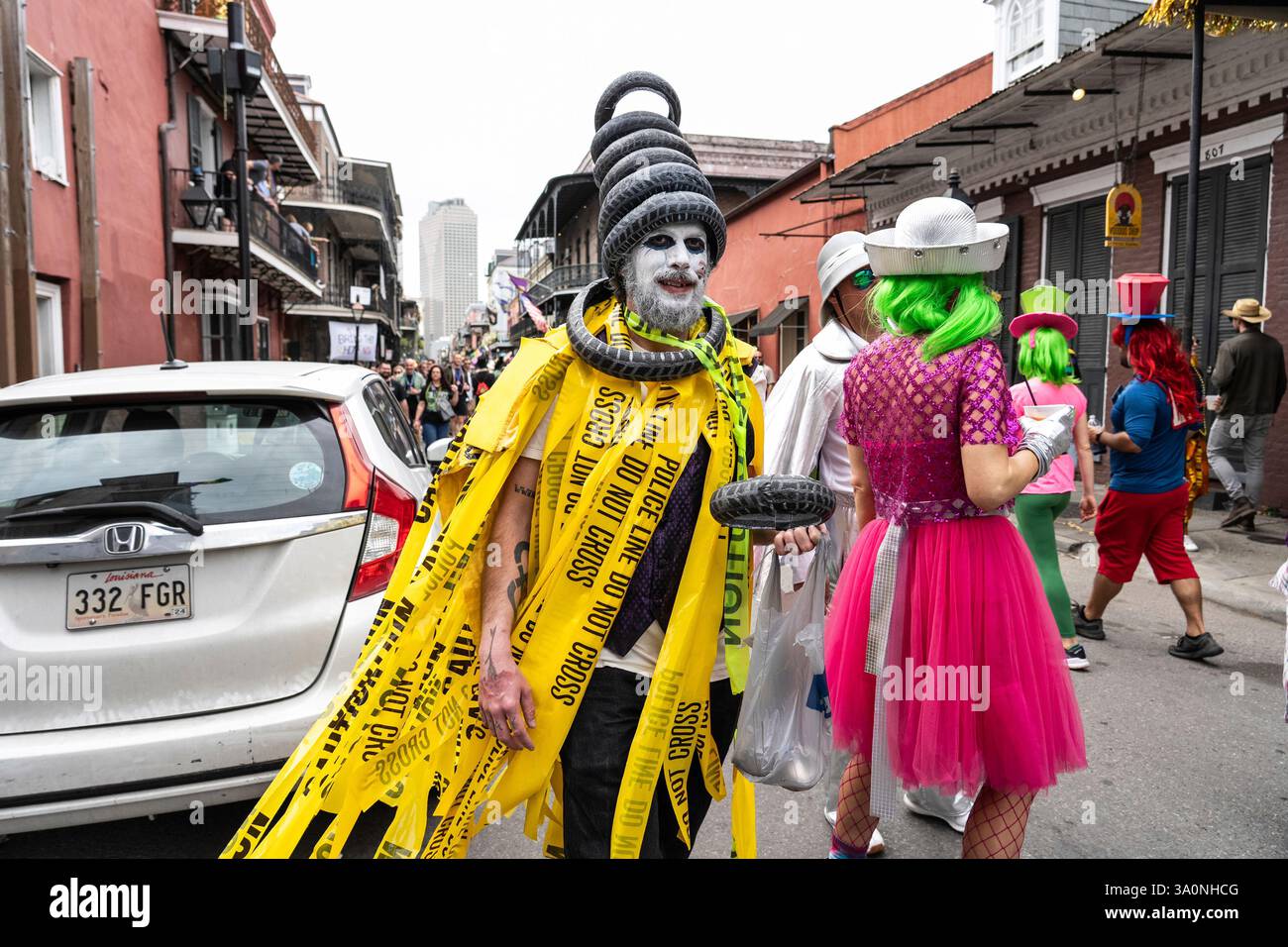 Paradegoers are seen in the French Quarter during Mardi Gras on Tuesday ...