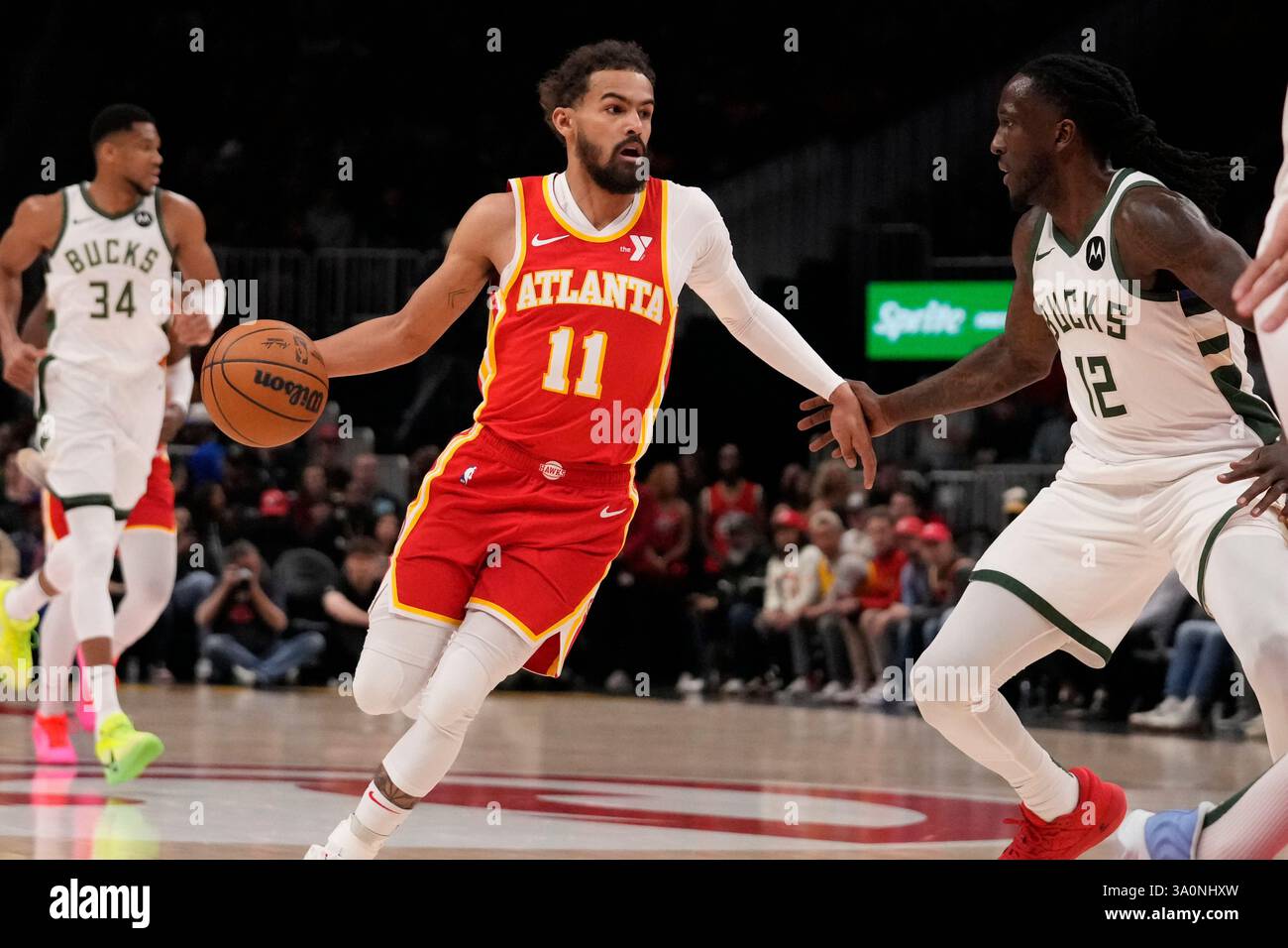 Atlanta Hawks guard Trae Young (11) dribbles in the first half of an ...