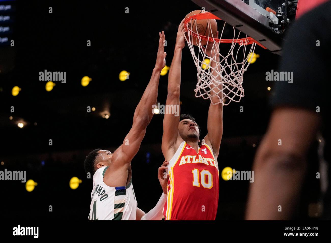 Atlanta Hawks forward Zaccharie Risacher (10) scores against Milwaukee ...