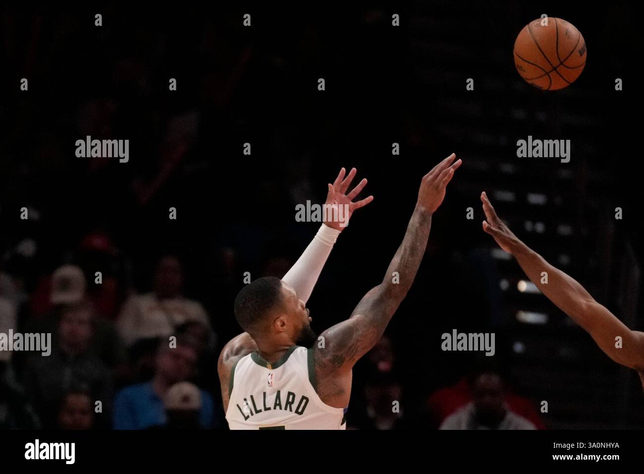 Milwaukee Bucks guard Damian Lillard (0) shoots the ball in the first ...