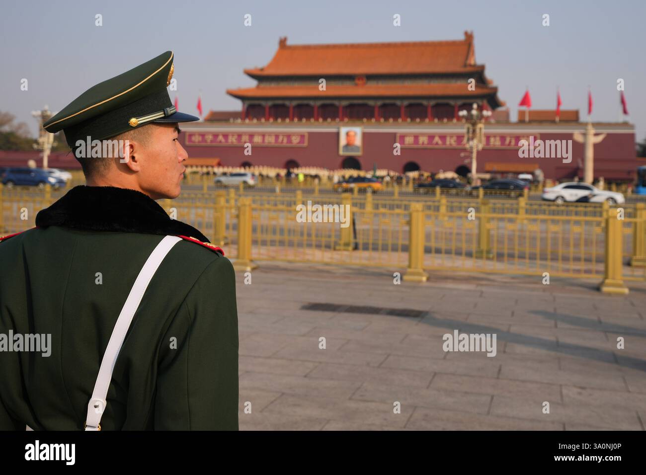 A paramilitary police officer stands guard in Tiananmen Square during ...