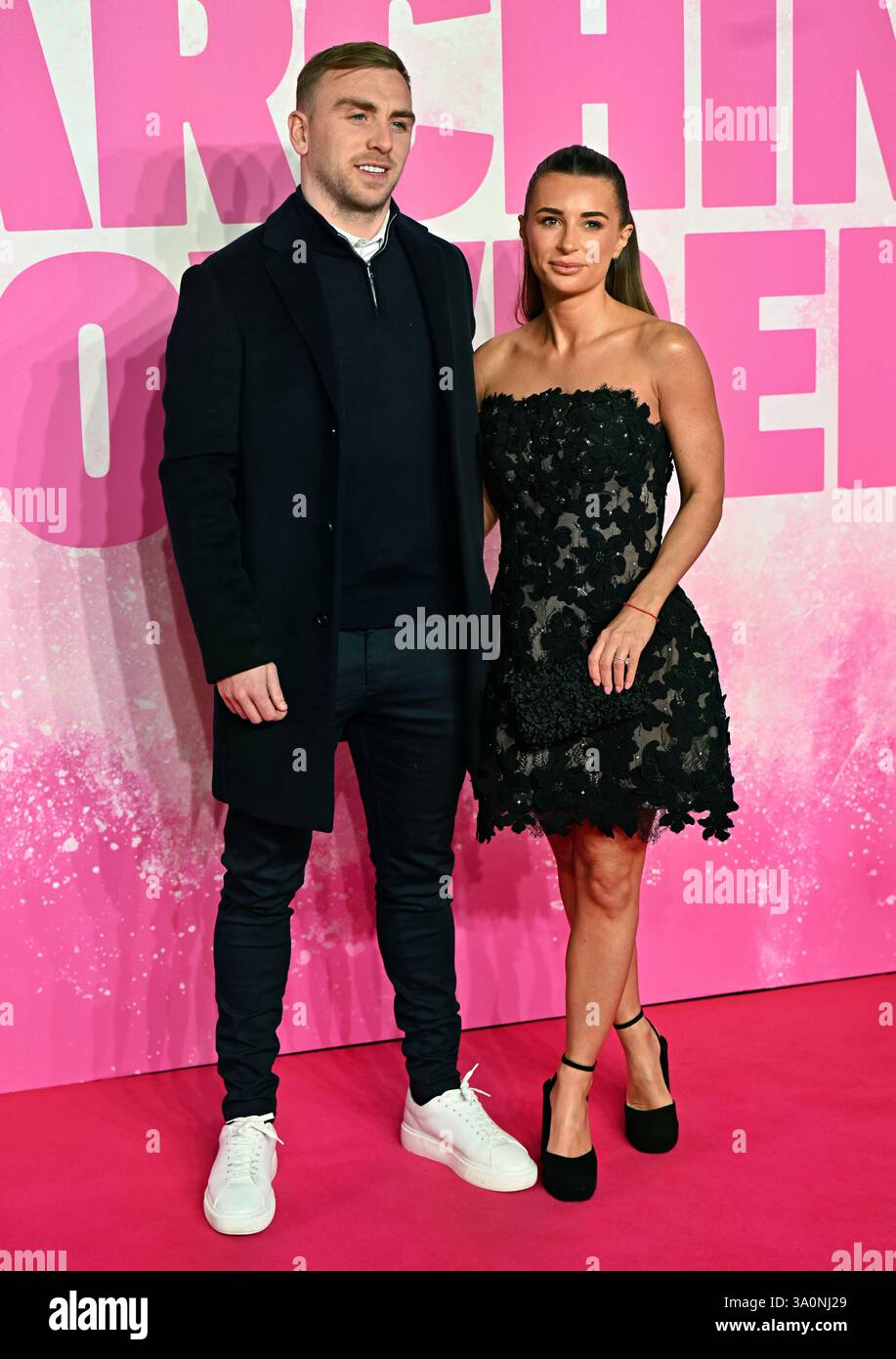 LONDON, ENGLAND - MARCH 04: Jared Bowen and Dani Dyer attends Marching ...