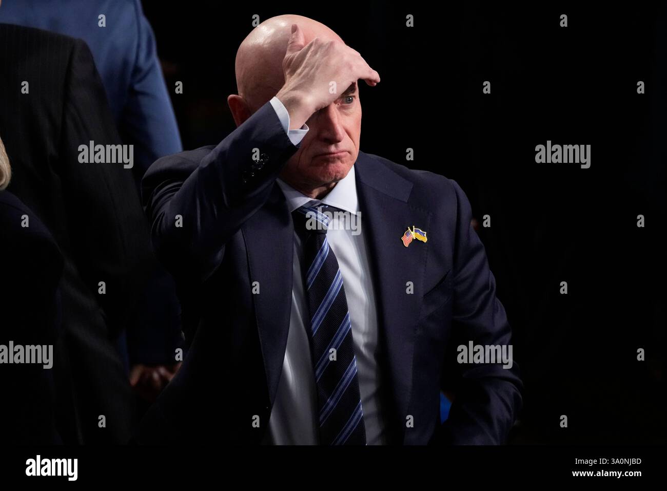 Sen. Mark Kelly, D-Ariz., arrives before President Donald Trump ...