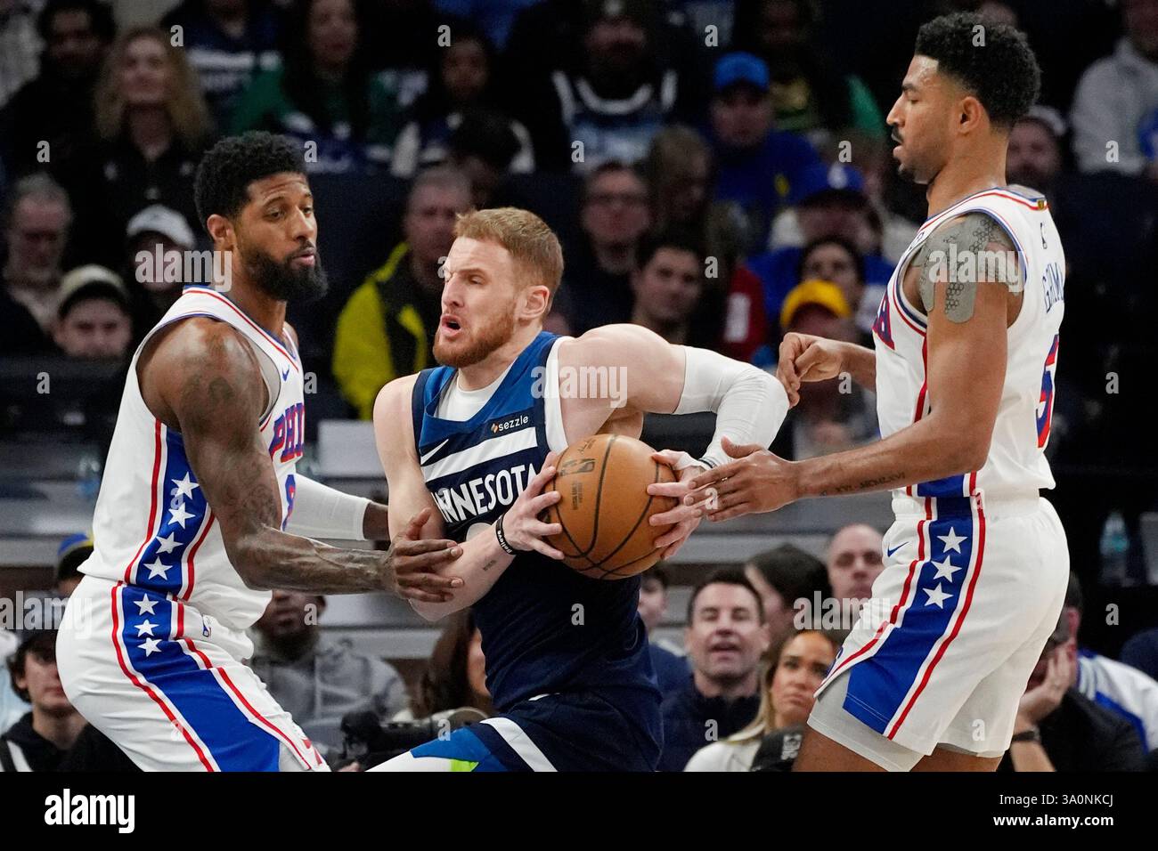 Minnesota Timberwolves guard Donte DiVincenzo, middle, drives to the ...