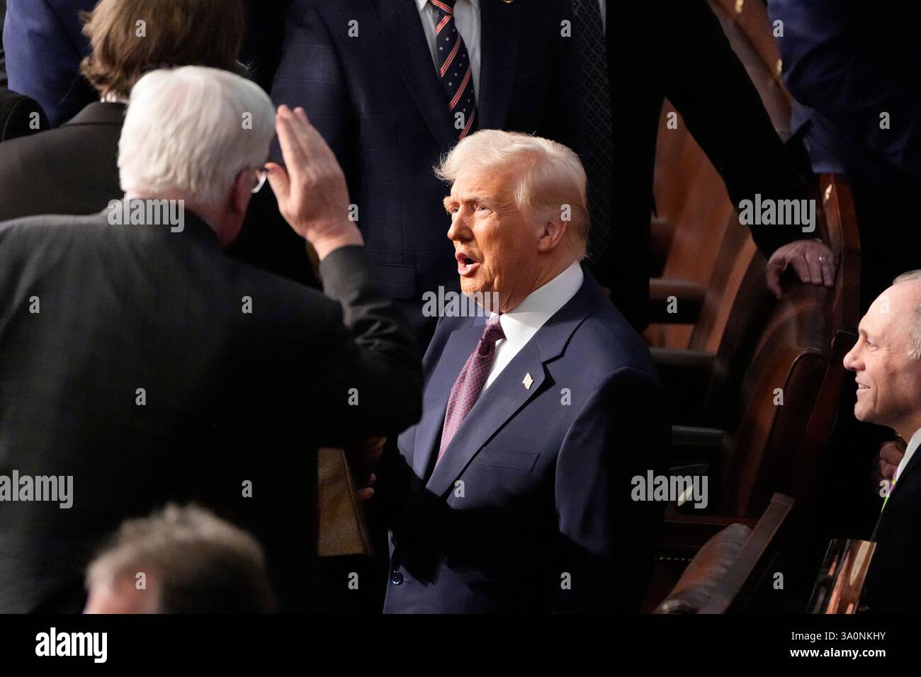 Members of Congress greet President Donald Trump as he arrives to ...
