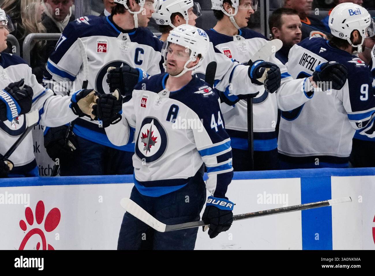 Winnipeg Jets' Josh Morrissey (44) celebrates with teammates after ...