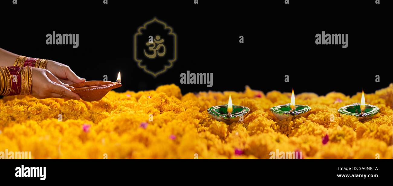 Happy Diwali - Diya lamps lit during diwali celebration. Translate Aum ...