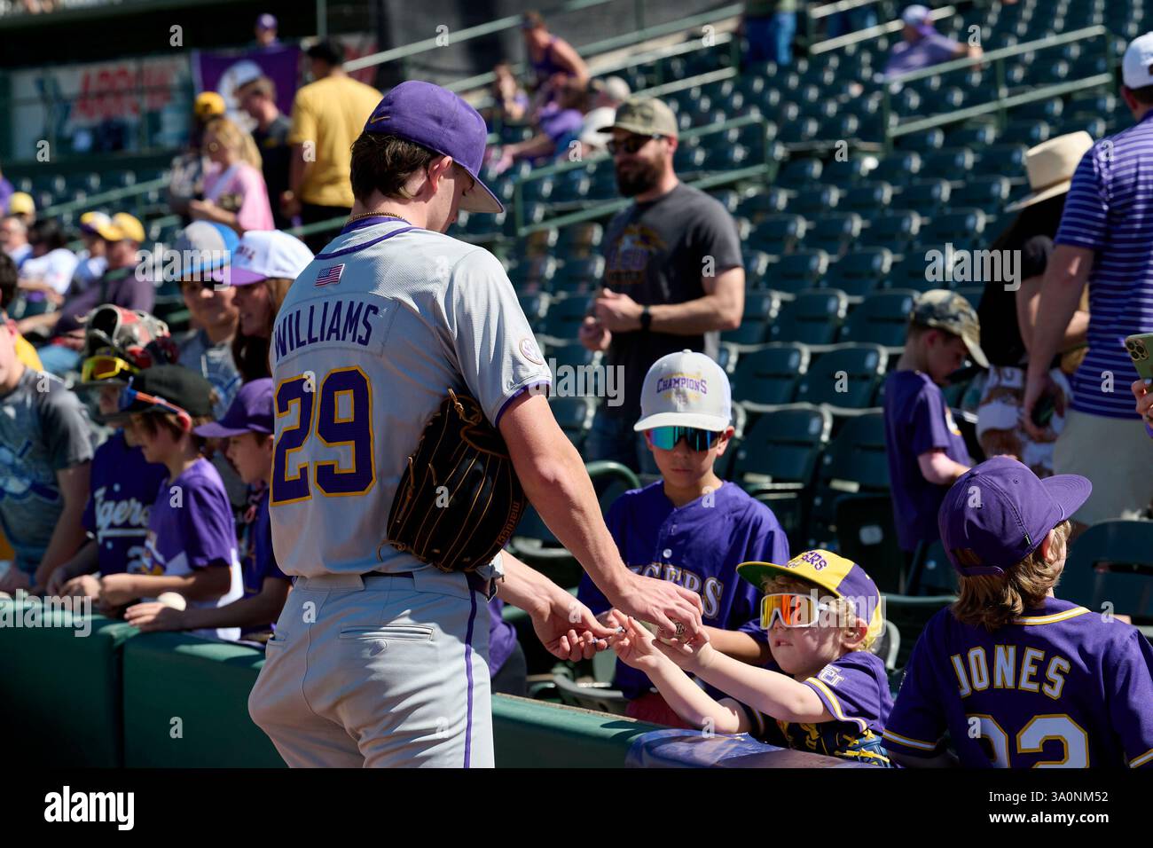 LSU Tigers pitcher Cooper Williams (29) signs autographs for young fans ...