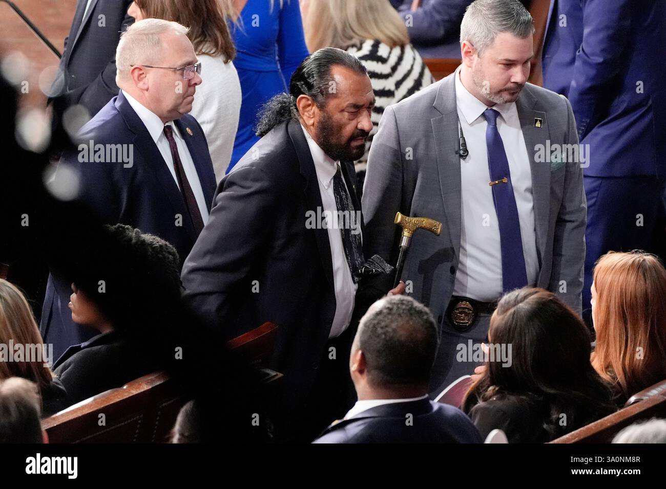Rep. Al Green, D-Texas, center, is escorted out as President Donald ...