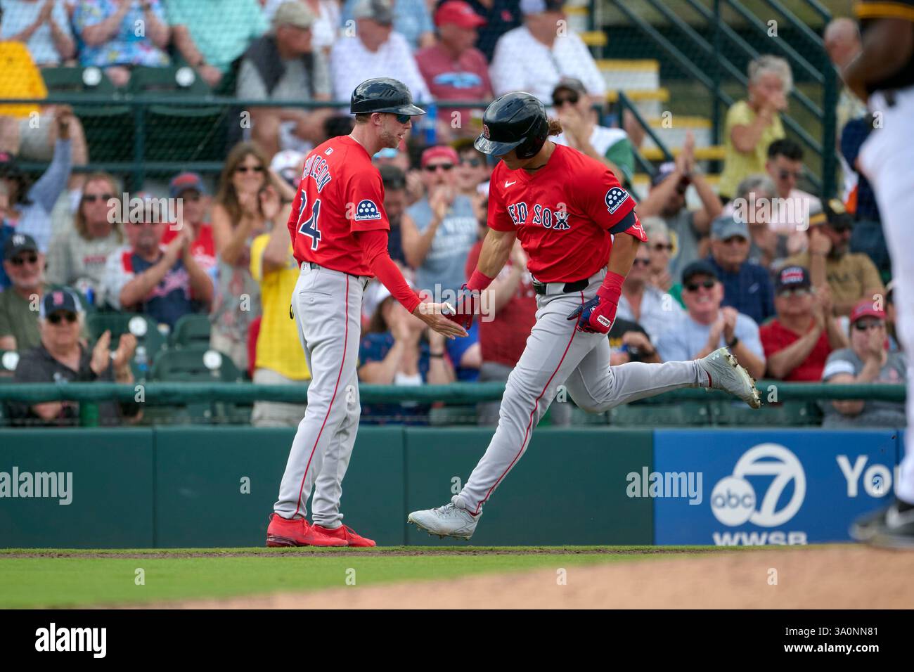 Boston Red Sox coach Kyle Hudson (84) congratulates Nate Eaton (40) as ...