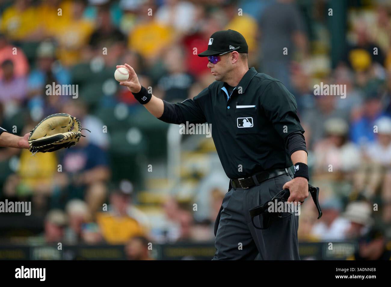 Home plate umpire Ryan Wills gives the catcher a new baseball during an ...