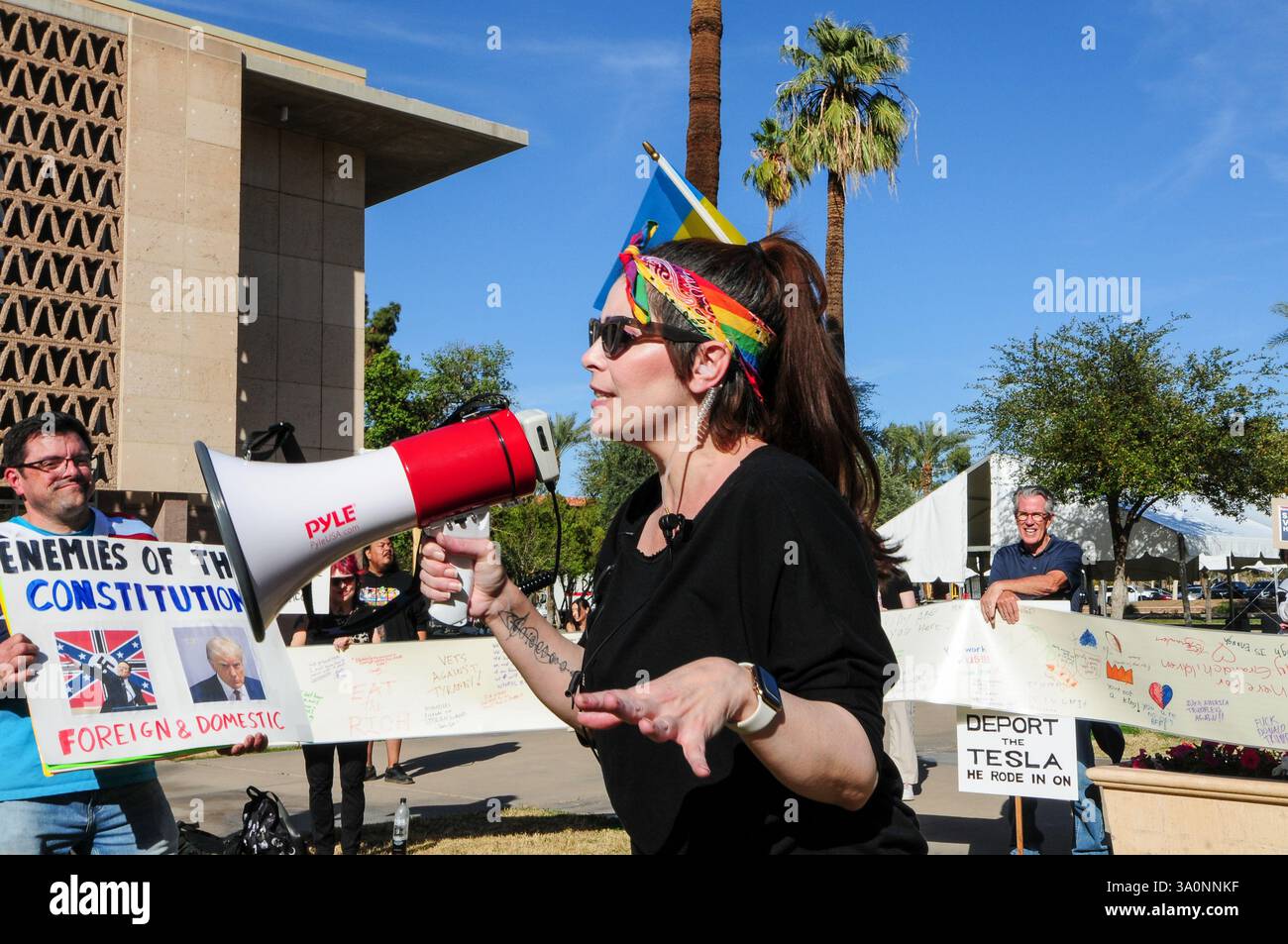 Phoenix, Arizona, USA. 4th Mar, 2025. A protester speaks into a ...