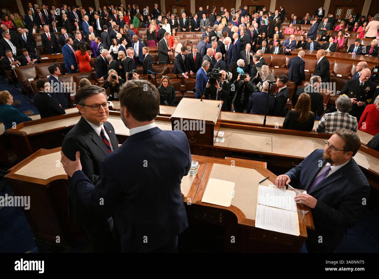 US Vice President JD Vance (C) speaks with Speaker of the House Mike ...
