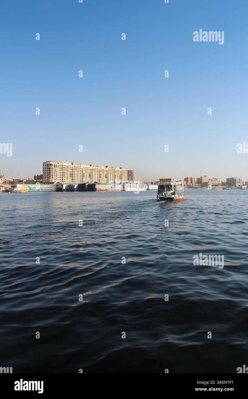 Felucca sailing on Nile River during sunset at Aswan, Egypt Stock Photo ...