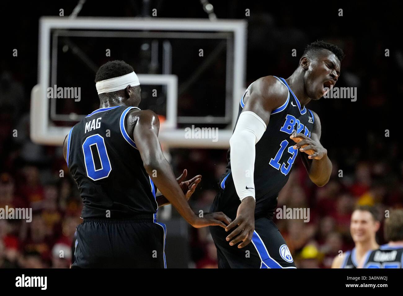 BYU center Keba Keita (13) celebrates with teammate forward Mawot Mag ...