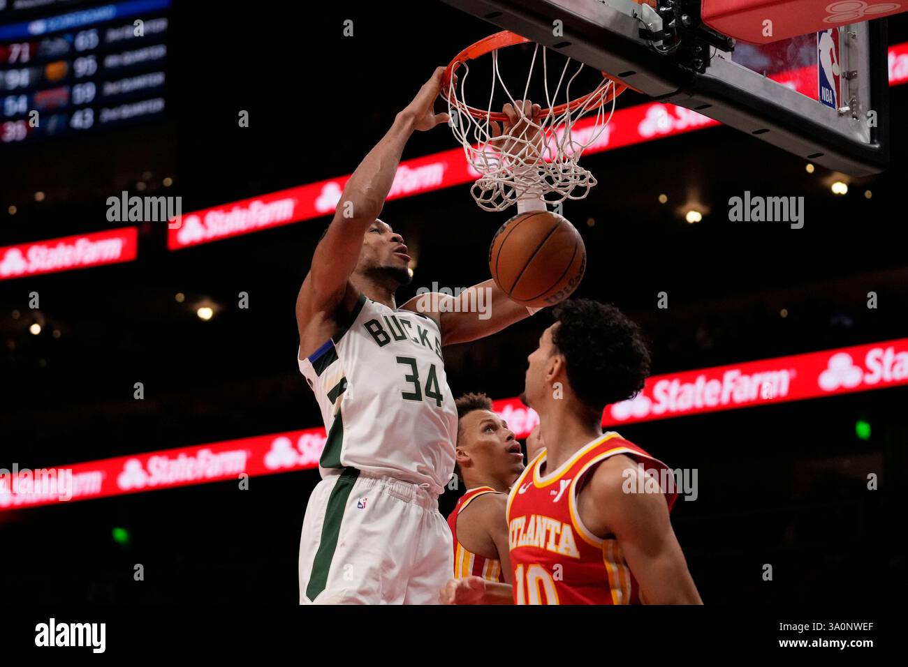 Milwaukee Bucks forward Giannis Antetokounmpo (34) shoots and scores in ...