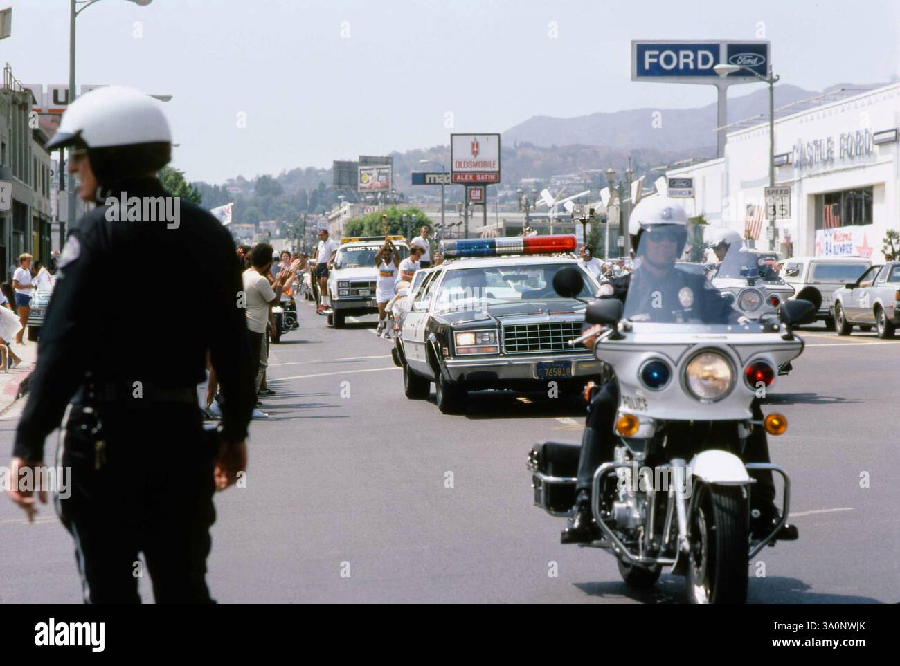 Los Angeles, CA, USA, 1984. Police leading the caravan of the Olympic ...