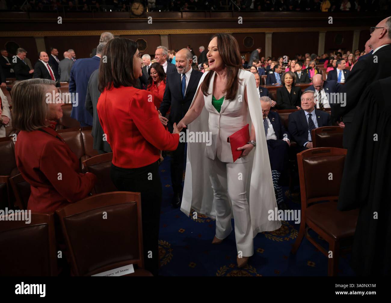 Secretary of Agriculture Brooke Rollins, center, arrives before President Donald Trump addresses ...