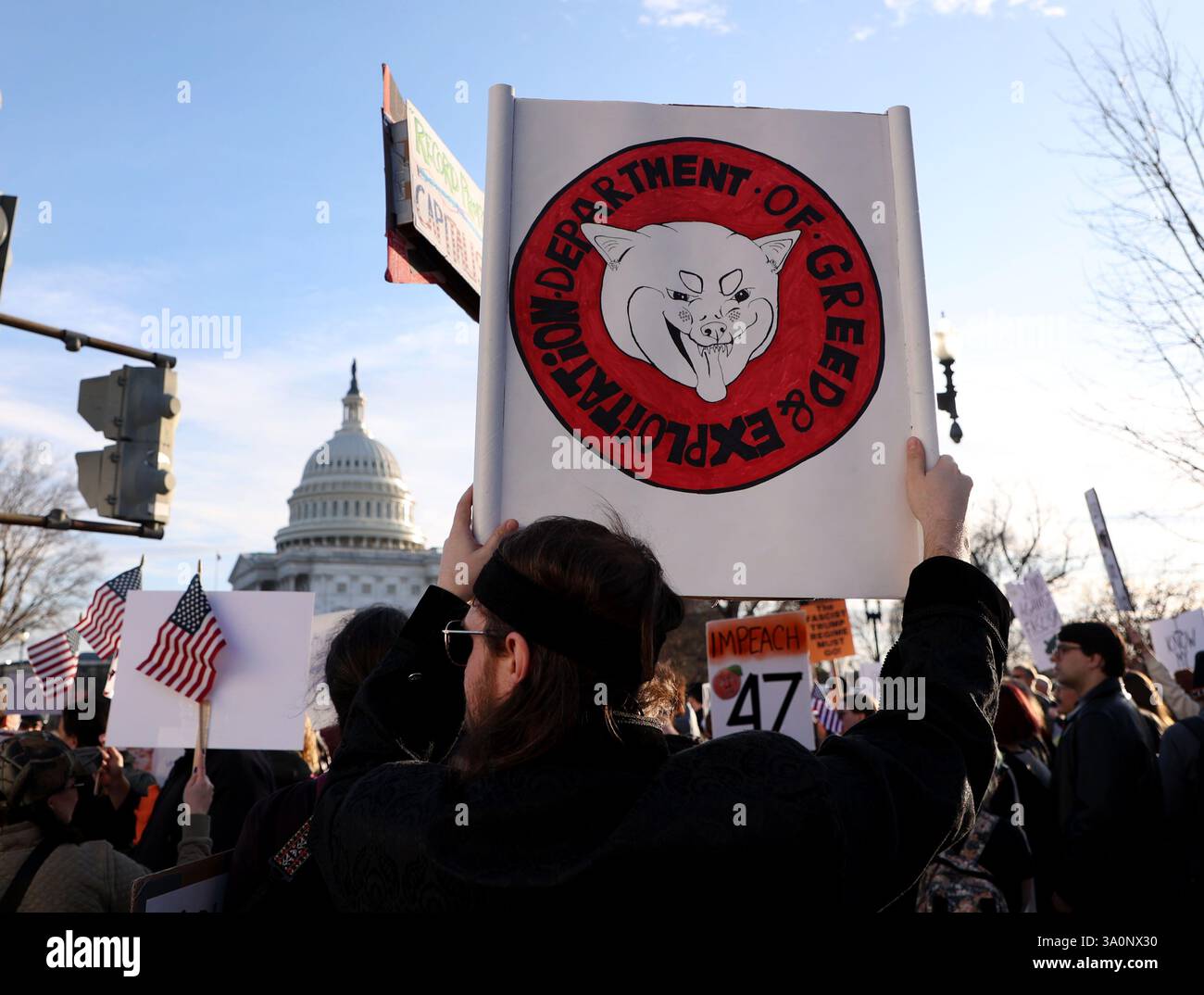 Washington Dc, Virginia, USA. 4th Mar, 2025. Demonstrators hold ...