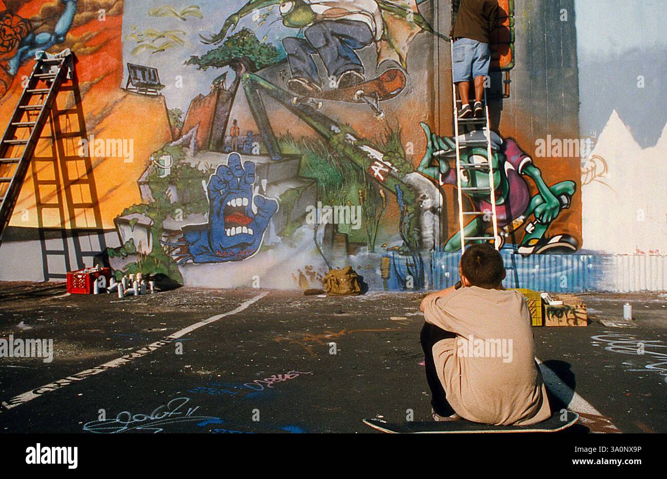 Artist painting a mural in Los Angeles, CA, USA, approx. 1992 Stock ...