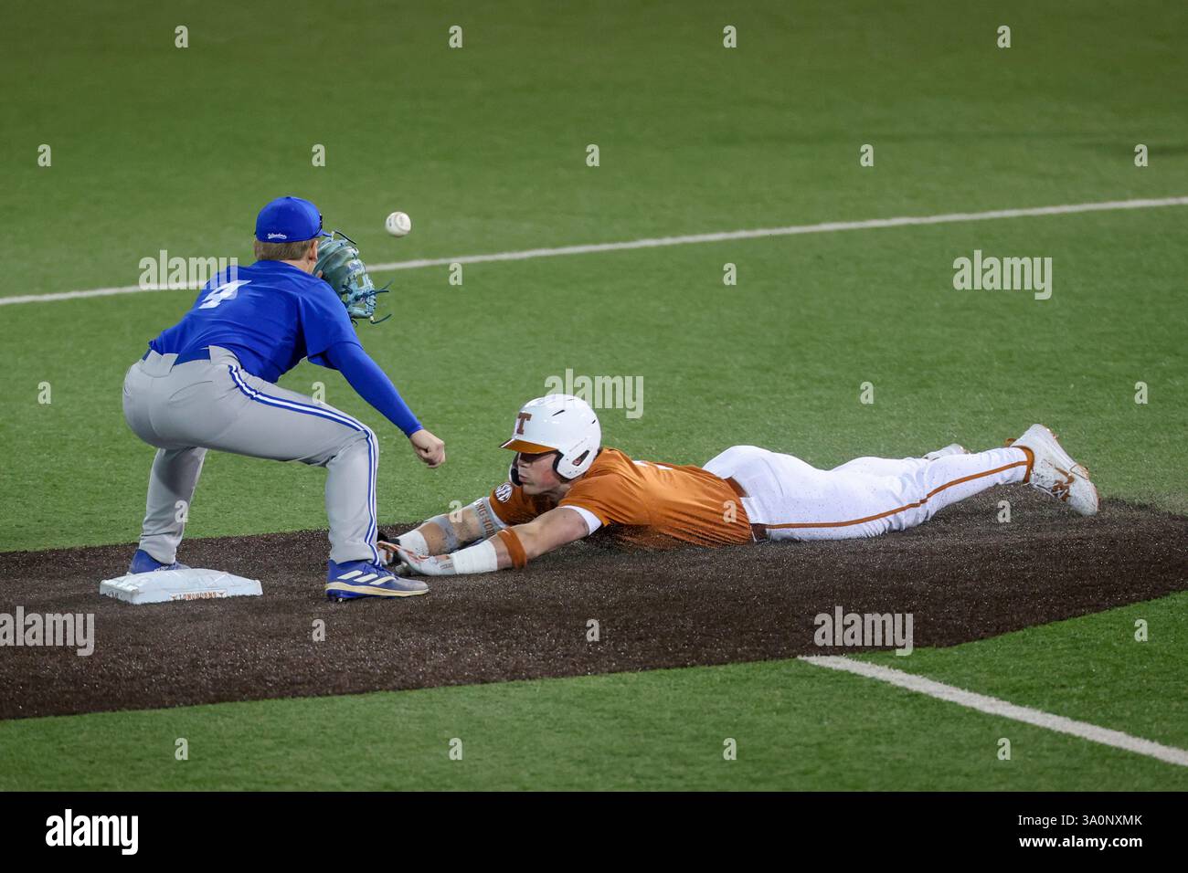 AUSTIN, TX - MARCH 04: Texas outfielder Easton Winfield (9) slides into ...