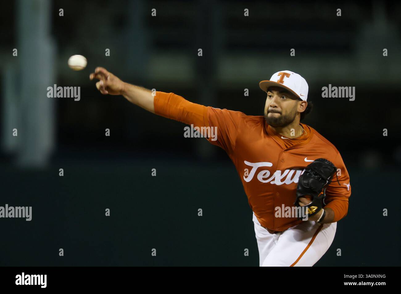 AUSTIN, TX - MARCH 04: Texas pitcher Jason Flores (4) pitches the ball ...