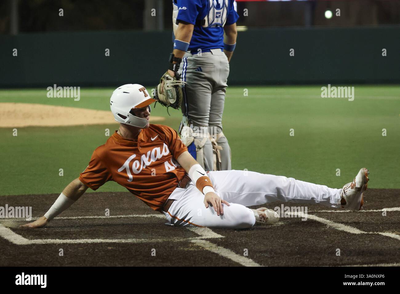 AUSTIN, TX - MARCH 04: Texas outfielder Max Belyeu (44) slides into ...