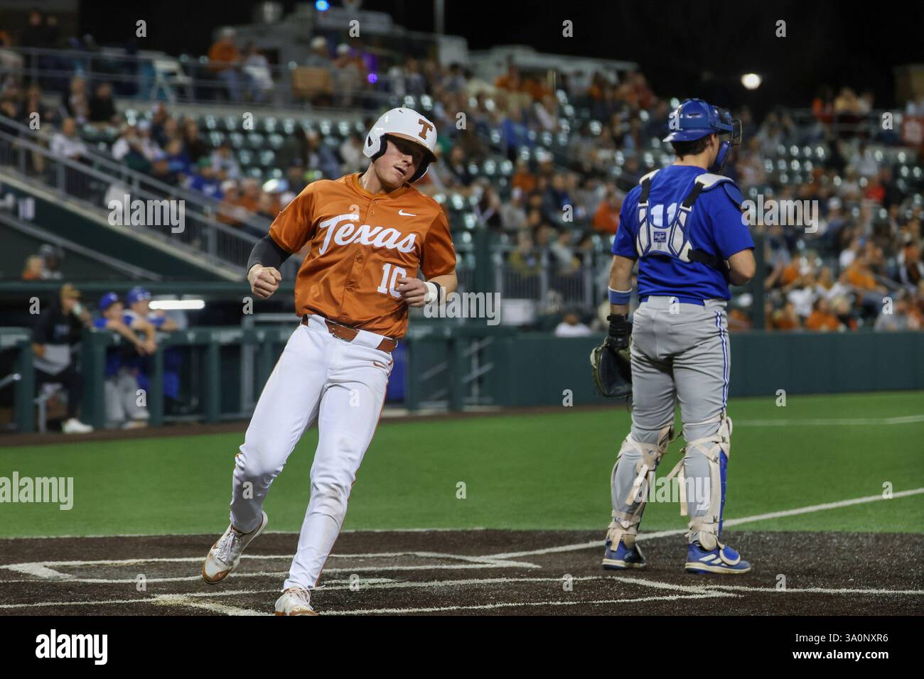 AUSTIN, TX - MARCH 04: Texas catcher Kimble Schuessler (10) crosses ...