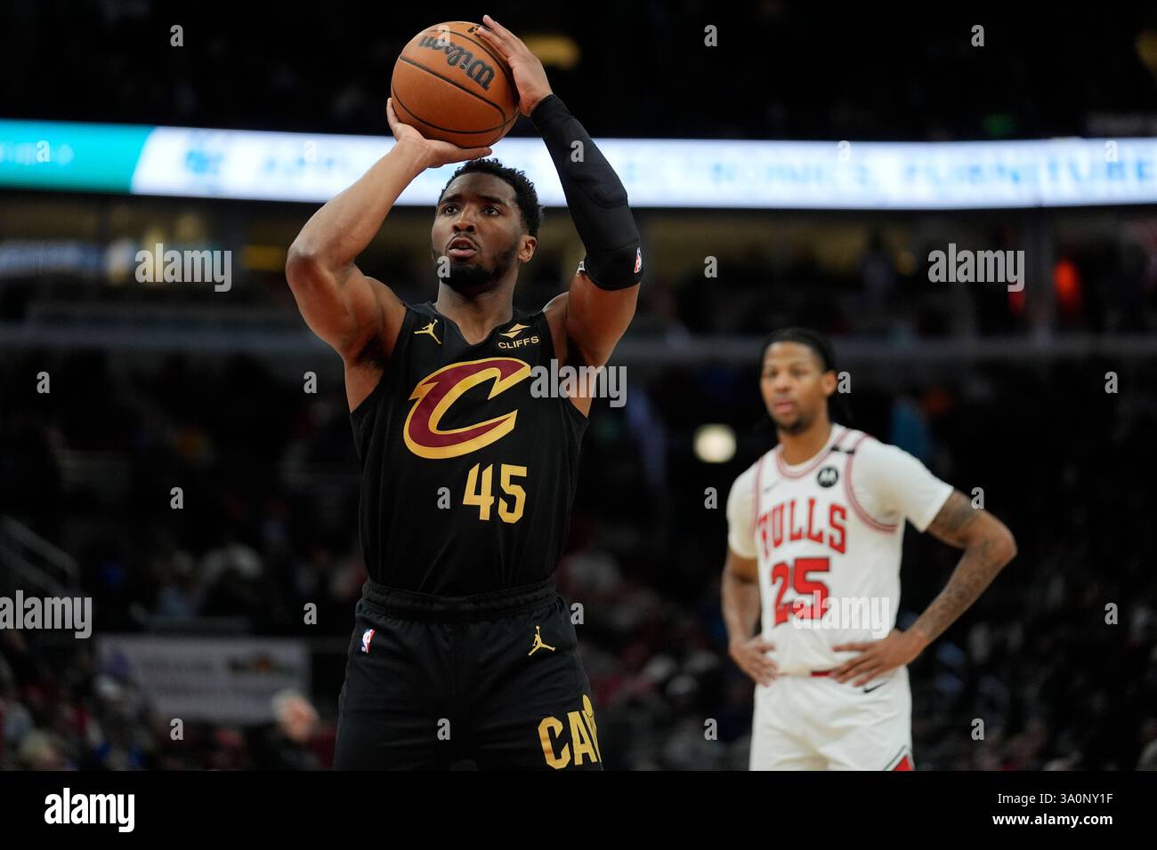 Cleveland Cavaliers guard Donovan Mitchell (45) takes a free throw ...