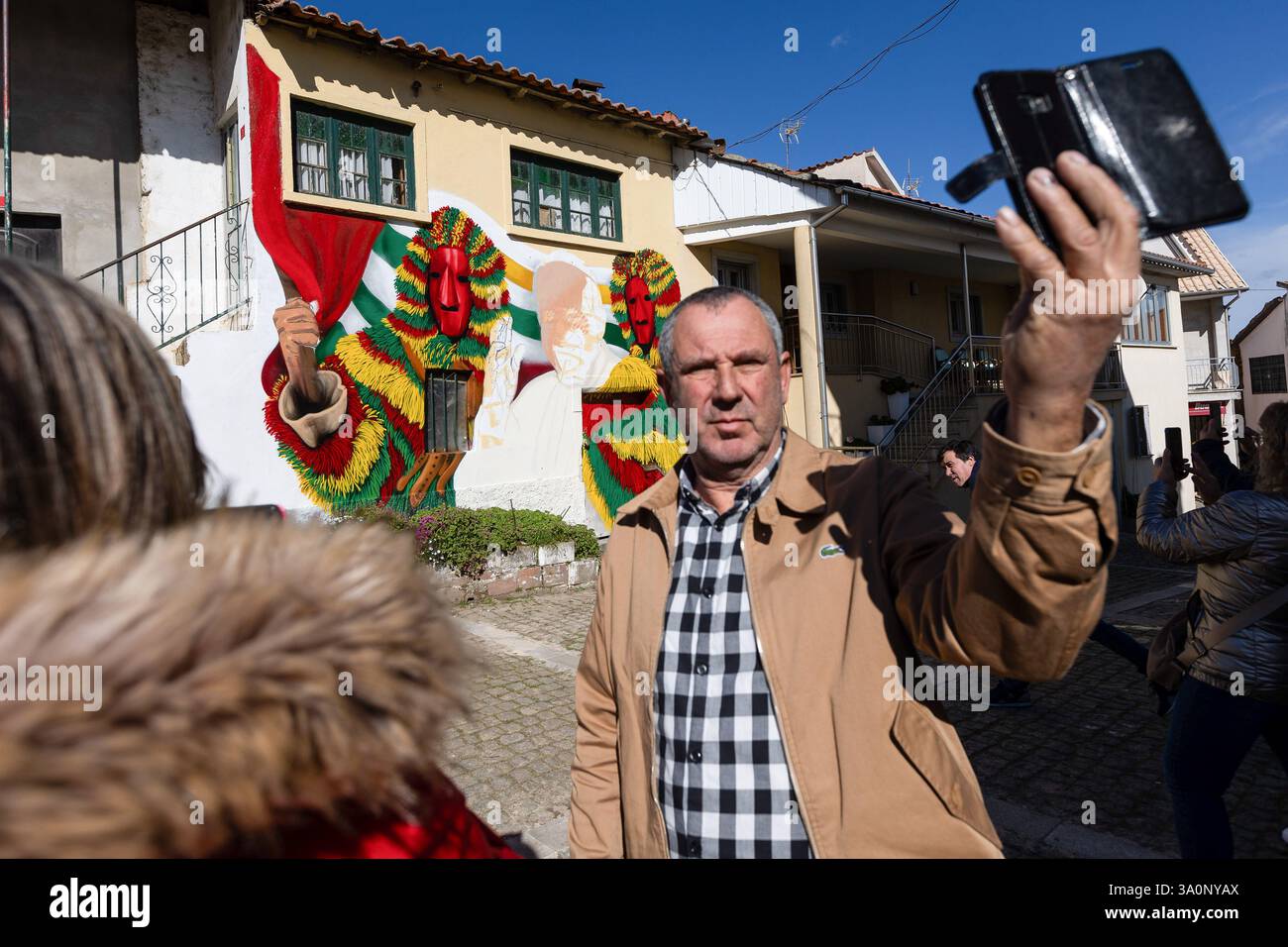 Visitors are observed photographing the newly painted mural honoring ...