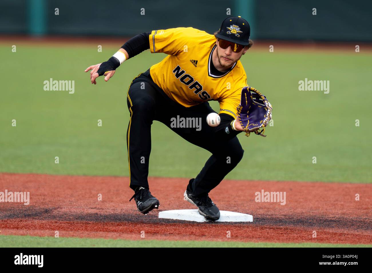 Northern Kentucky infielder Brennan Rowe (21) fields a throw to second ...