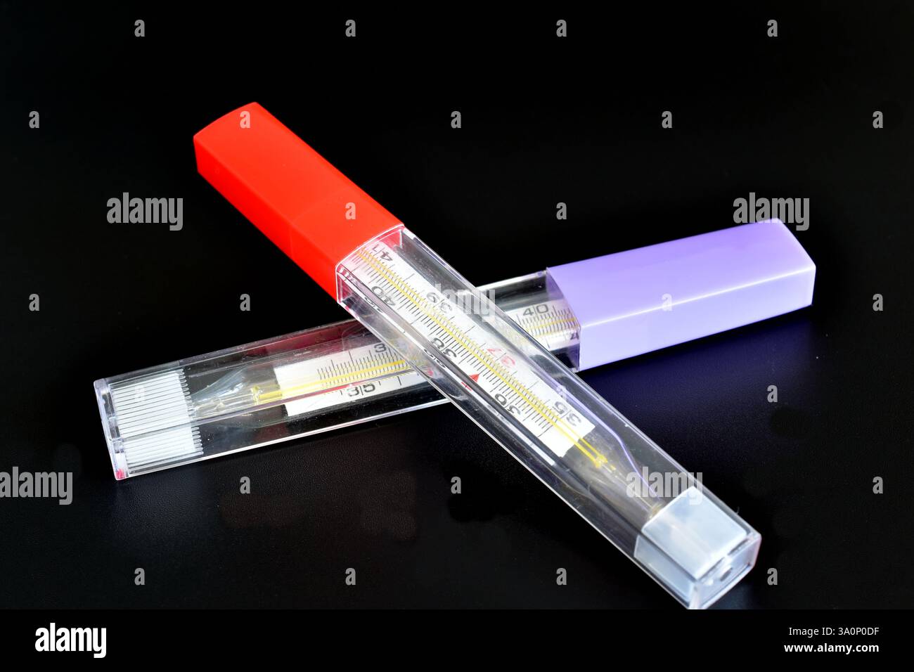 Two mercury thermometers for measuring human body temperature in ...