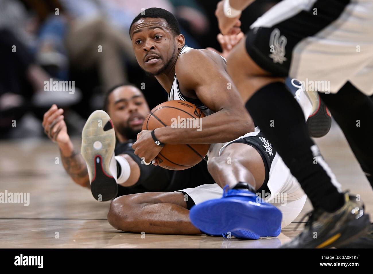 San Antonio Spurs guard De'Aaron Fox, center, tangles with Brooklyn ...