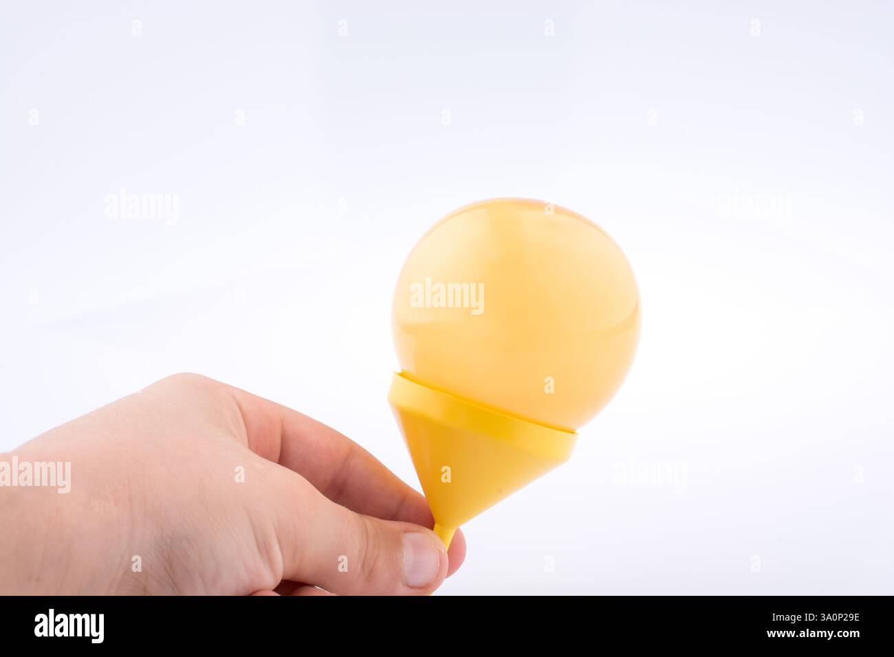 Balloon in a funnel on white background Stock Photo - Alamy