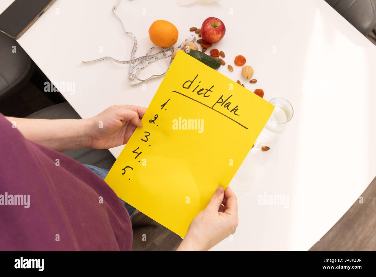 A vibrant meal prep scene features a detailed diet plan on yellow paper with fresh cooking ...