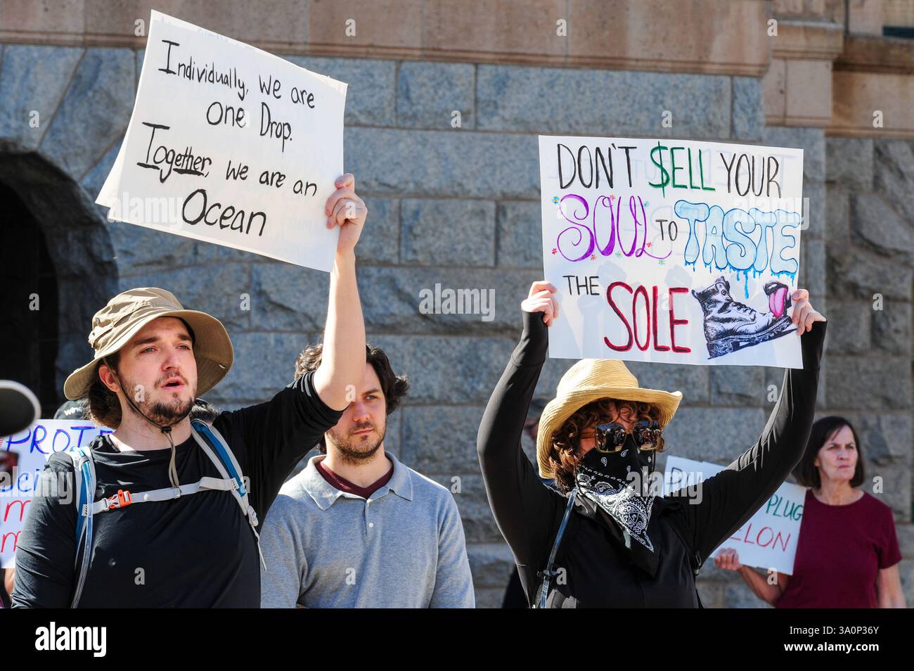 Phoenix, Arizona, USA. 4th Mar, 2025. Protesters hold signs promoting ...