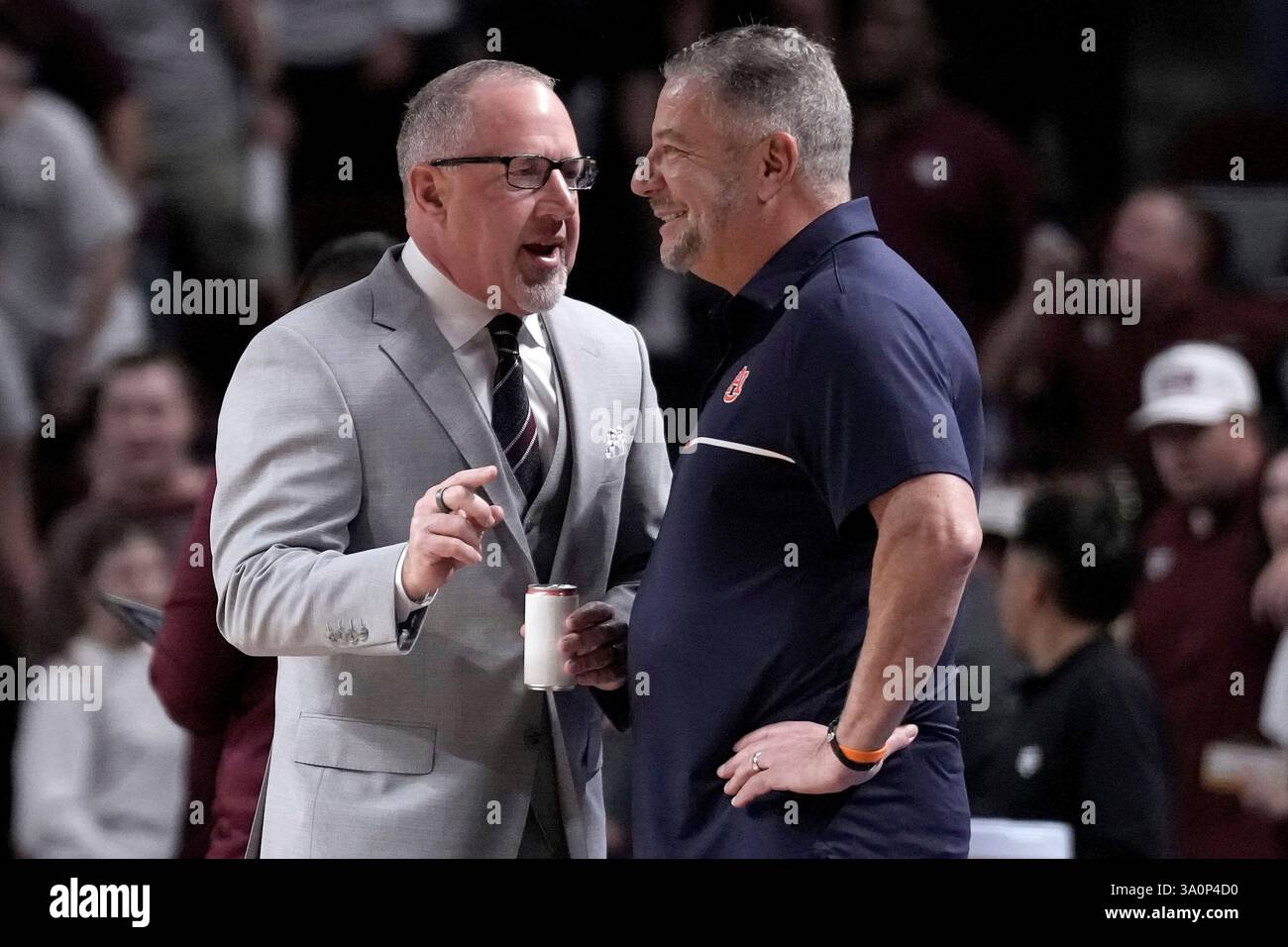 Texas A&M head coach Buzz Williams, left, and Auburn head coach Bruce ...