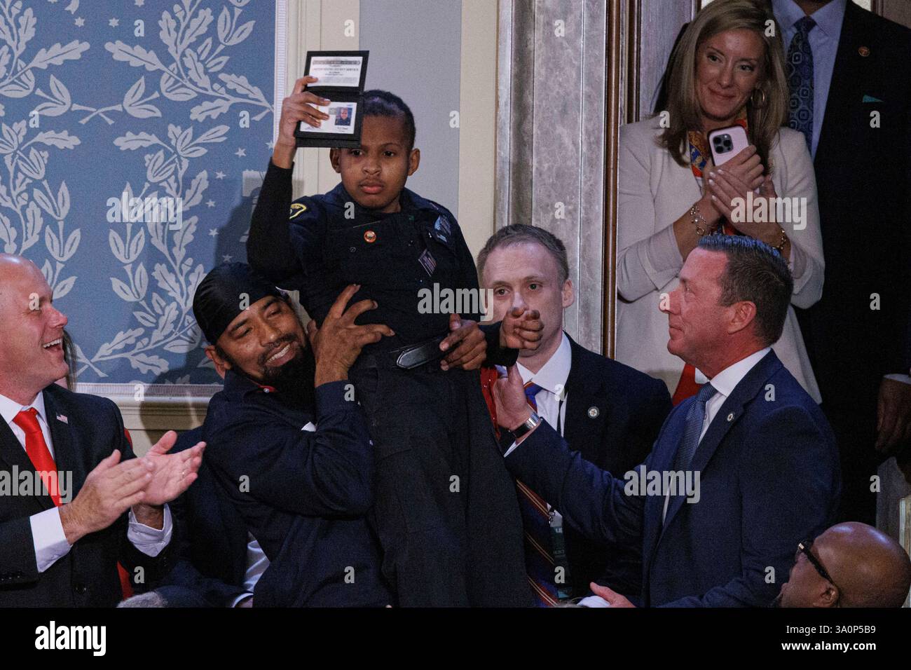 Cancer survivor Devarjaye "DJ" Daniel is applauded as President Donald ...