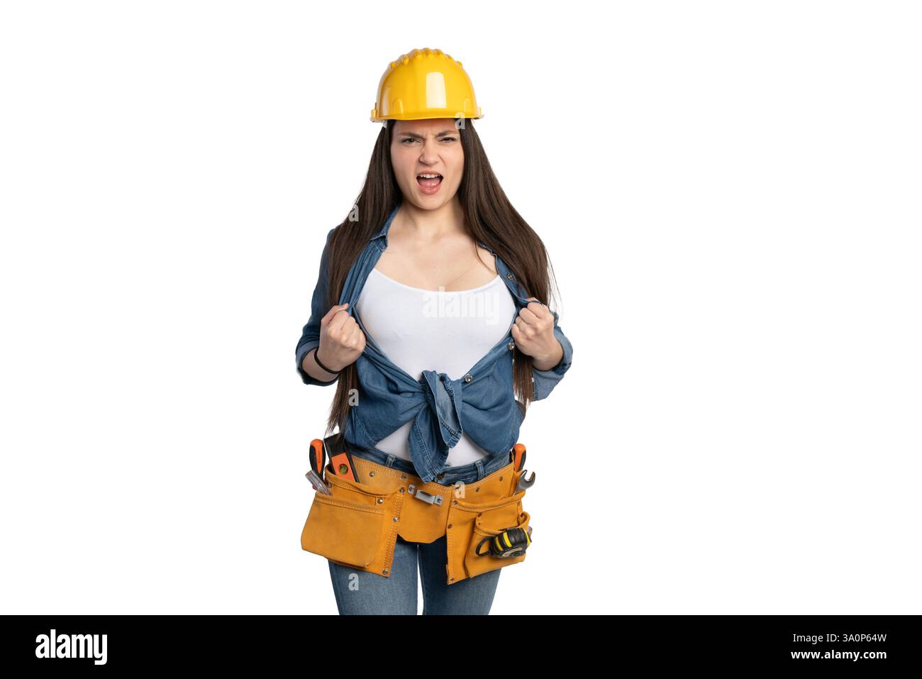 A determined female construction worker wearing a yellow hard hat and ...