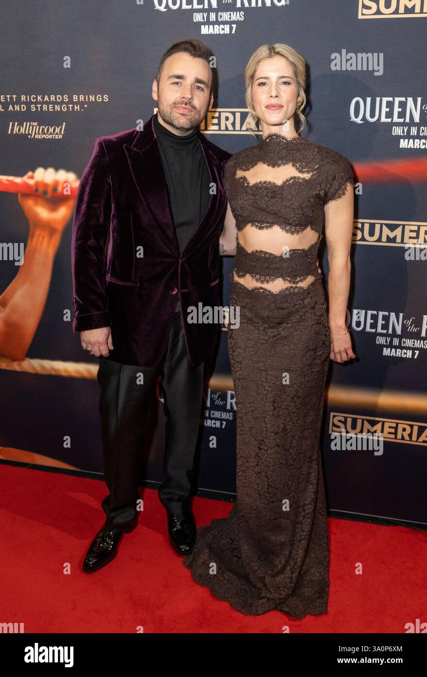 Ash Avildsen wearing suit by Tom Ford and Emily Bett Rickards wearing ...