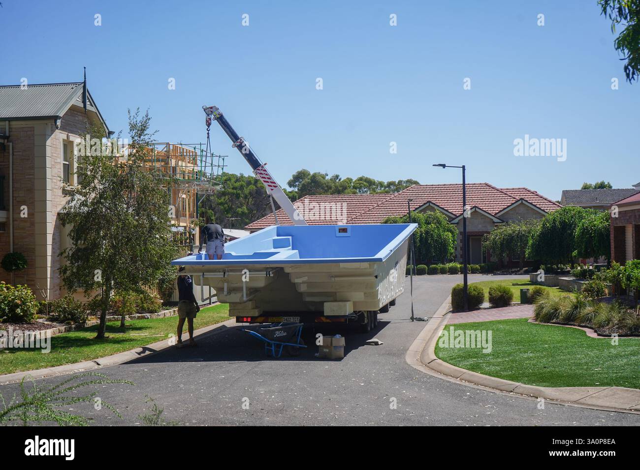 Adelaide, Australia 5 March 2025. A crane lifting a fiberglass swimming ...