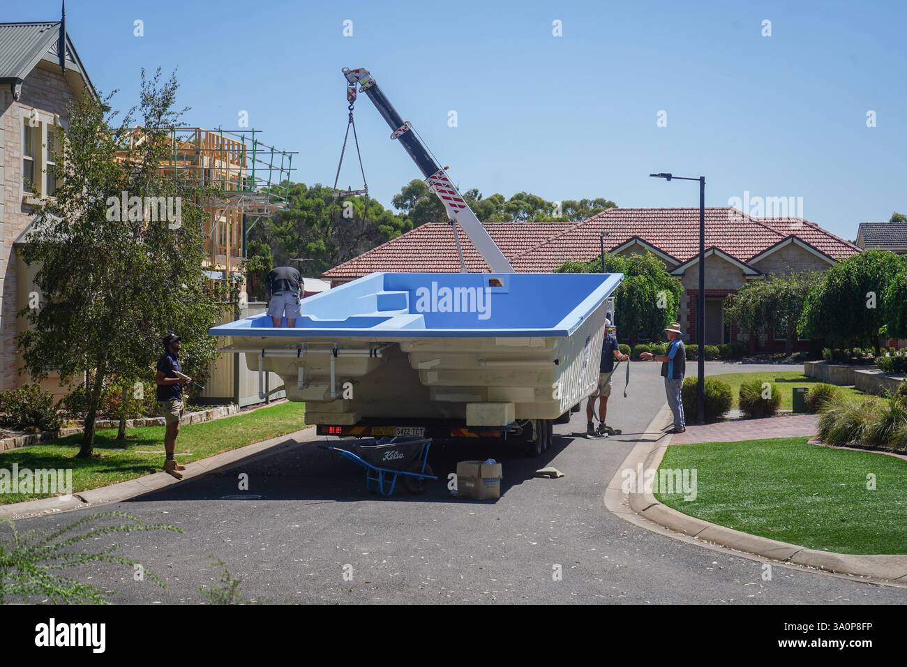 Adelaide, Australia 5 March 2025. A crane lifting a fiberglass swimming ...