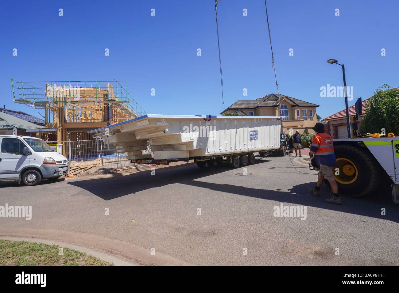 Adelaide, Australia 5 March 2025. A crane lifting a fiberglass swimming ...