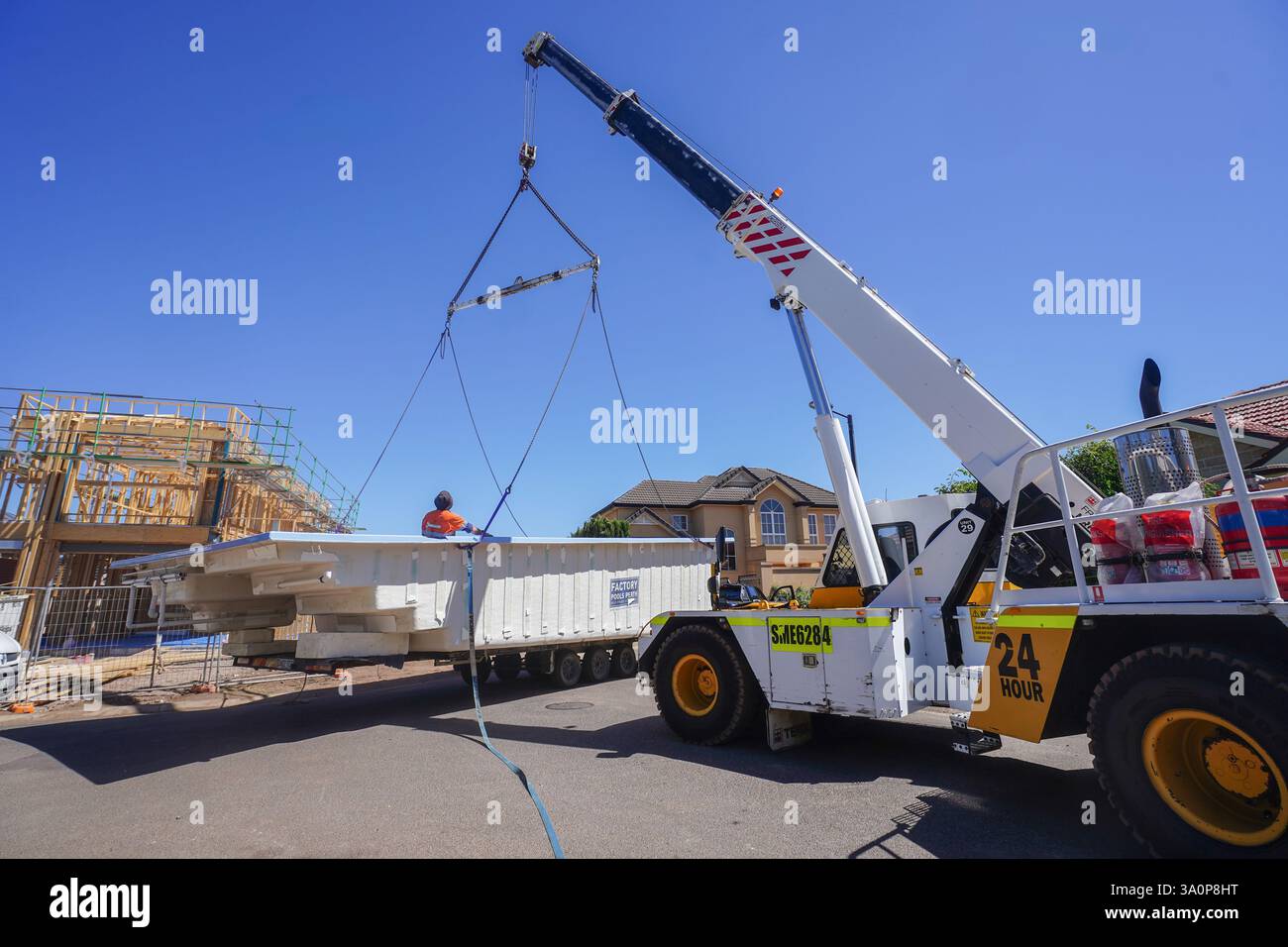 Adelaide, Australia 5 March 2025. A crane lifting a fiberglass swimming ...