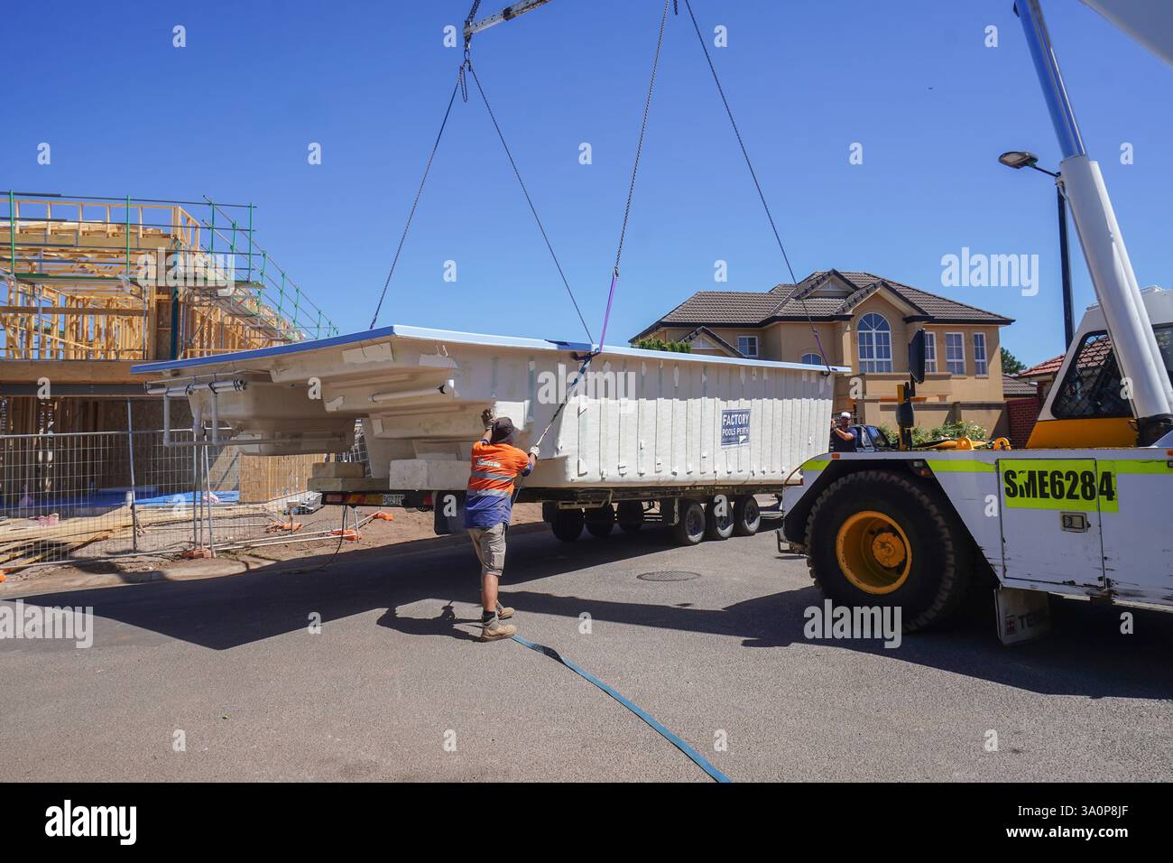 Adelaide, Australia 5 March 2025. A crane lifting a fiberglass swimming ...