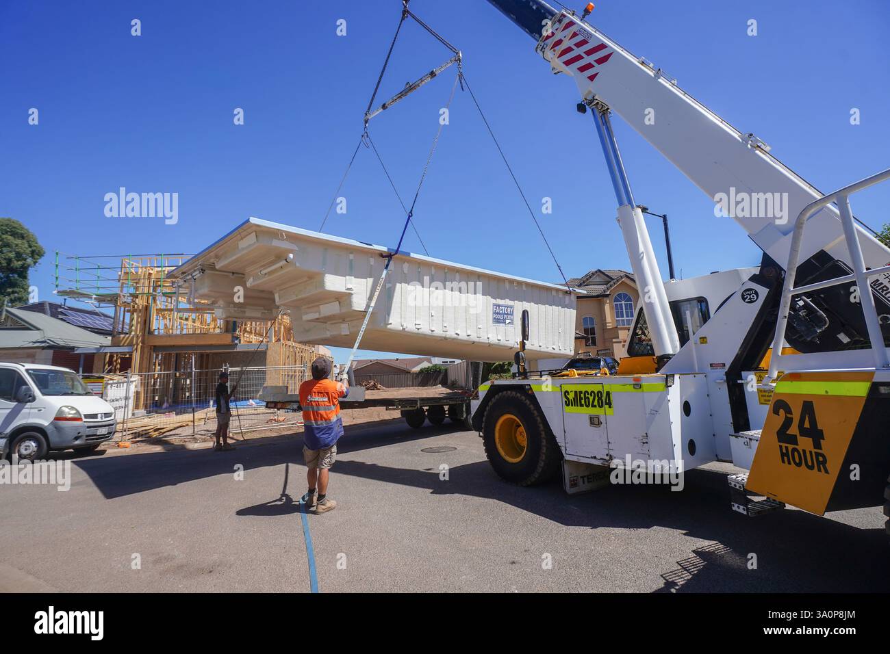 Adelaide, Australia 5 March 2025. A crane lifting a fiberglass swimming ...