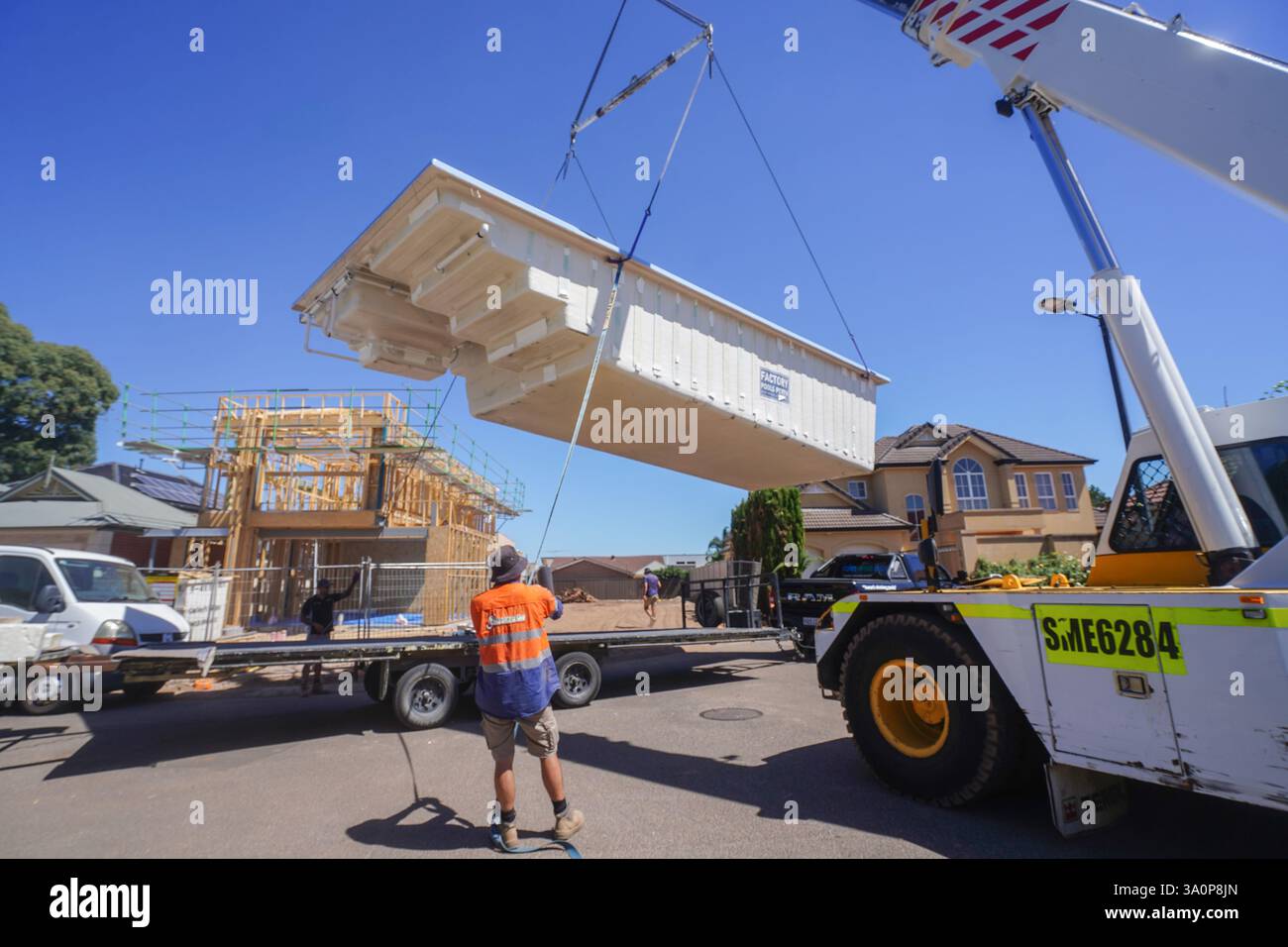 Adelaide, Australia 5 March 2025. A crane lifting a fiberglass swimming ...