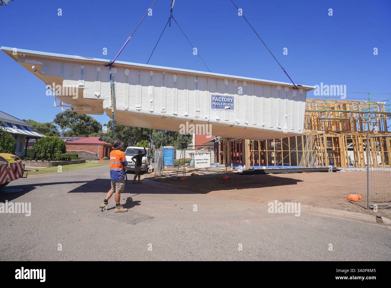 Adelaide, Australia 5 March 2025. A crane lifting a fiberglass swimming ...