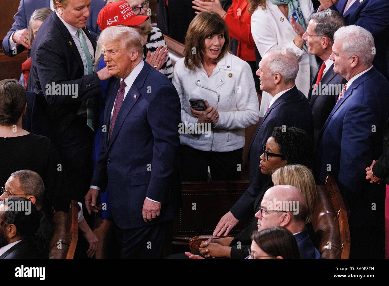 Senate and House Democrats remain seated as President Donald J. Trump ...