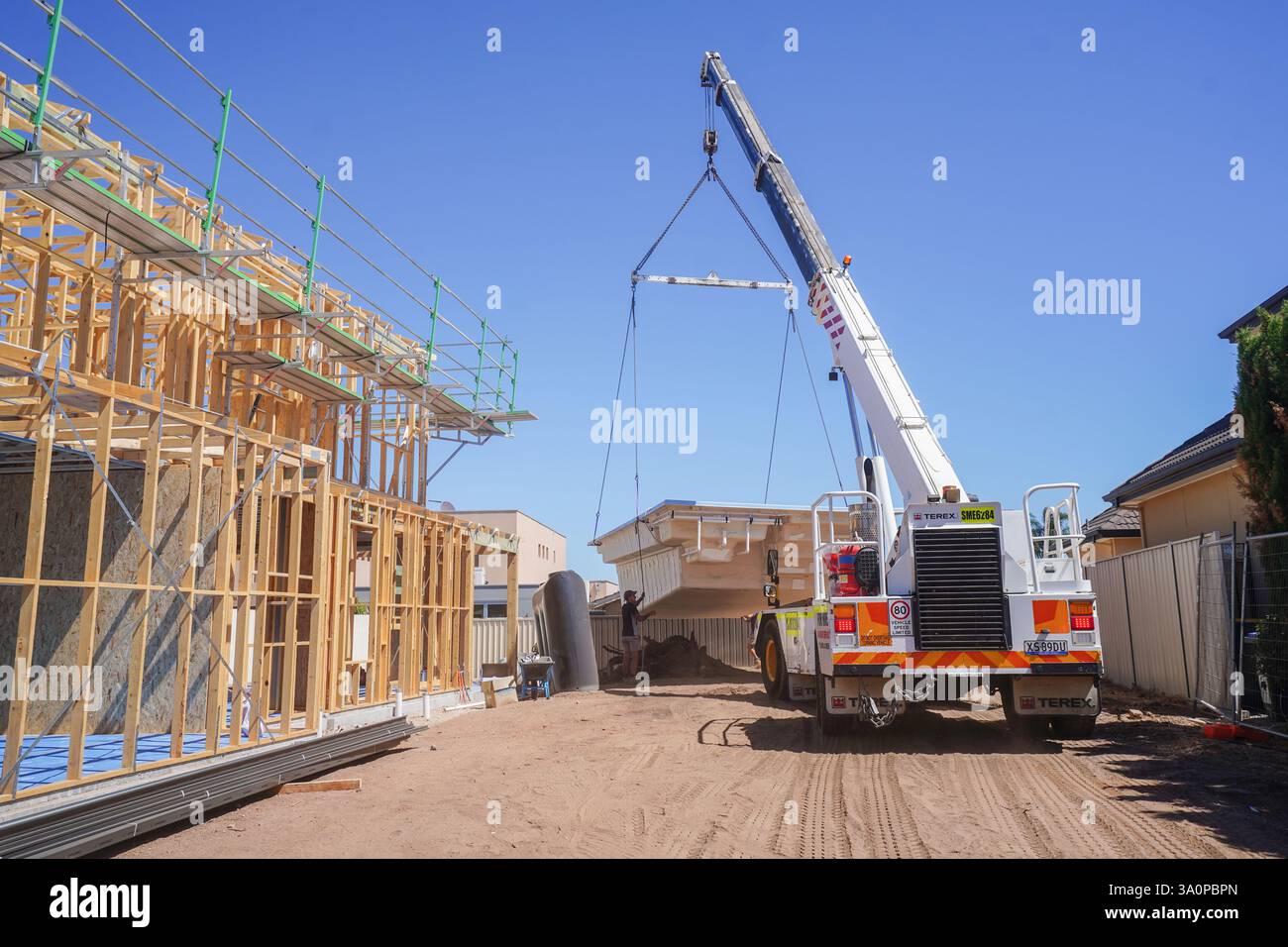 Adelaide, Australia 5 March 2025. A crane lifting a fiberglass swimming ...